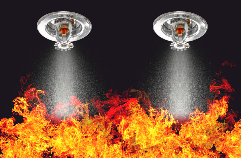 Image of Fire Sprinklers Spraying with fire background. Fire sprinklers ...